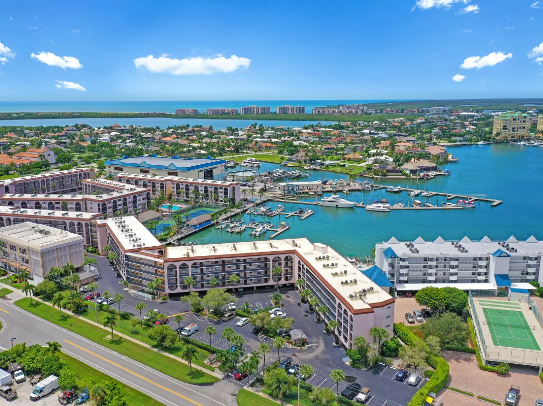 Balcony With Heated Pool View And Luxurious Amenities - Stunning Tropical Oasis - Marco Island, FL